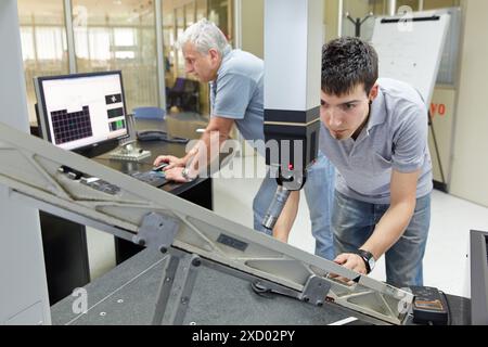 The SAT team calibrating three-dimensional machine. Calibration of CMM ...