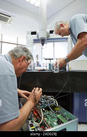The SAT team calibrating three-dimensional machine. Calibration of CMM ...