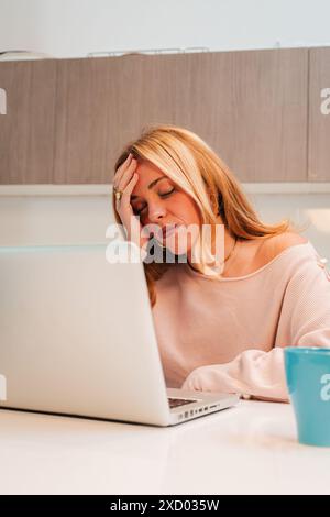Young employee unhappy with excessive work Stock Photo - Alamy