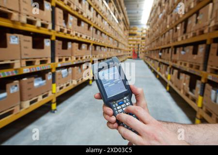 Barcode reader. Boxes with industrial parts. Warehouse palletizing ...