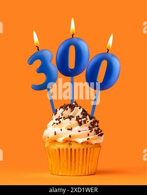 Number 300 birthday candle - Cupcake on black background with out of ...