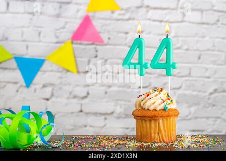 Birthday number 44 - Green birthday candle on white background Stock ...