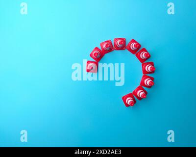 Mini plastic cones that have been arranged on a yellow background Stock ...