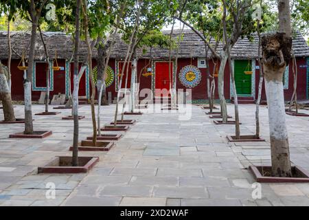colorful artistic designed traditional teak and bush home at evening ...