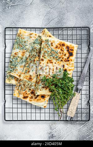 Gozleme Turkish stuffed pastrie, flatbread with greens and cheese ...