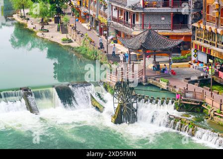 Water wheel and waterfall on the Tuojiang River, Fenghuang Stock Photo ...