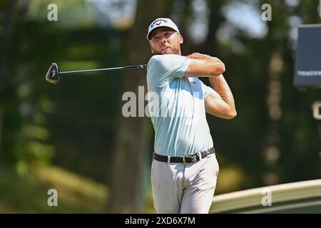 Sam Burns watches his tee shot on the 13th hole during the final round ...