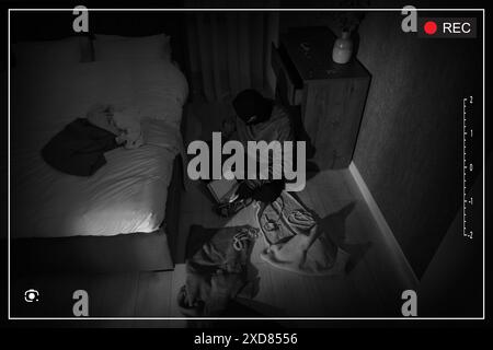 Thief robbing house, view through surveillance camera Stock Photo - Alamy