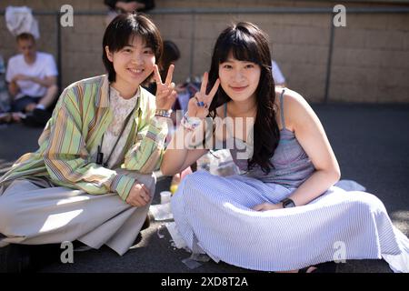 Angie, 21, and Ohana, 25, both Taylor Swift fans, pose for a photo as ...