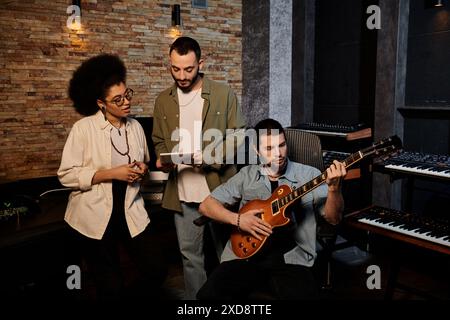 Group of musicians rehearsing together with instruments in a studio ...