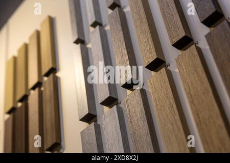 A stand with samples of decorative rails made of duropolymer in a ...