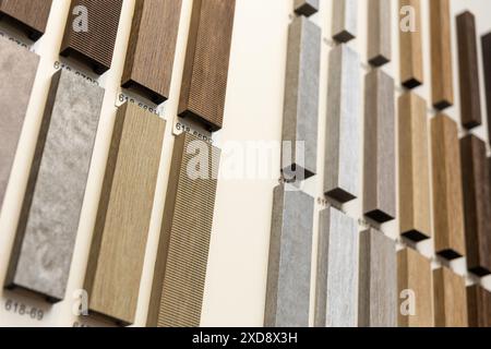 A stand with samples of decorative rails made of duropolymer in a ...