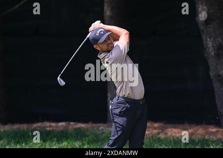 Xander Schauffele watches his tee shot on the 14th hole during a ...