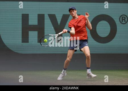 Jannik Sinner of Italy plays a forehand return to Ben Shelton of the U.S. during their semifinal ...