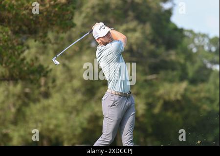 Sam Burns watches his tee shot on the 13th hole during the final round ...
