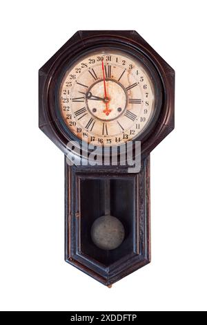 An antique clock placed on a wooden table Stock Photo - Alamy