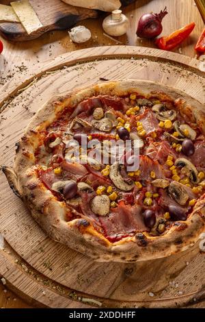 Homemade pizza (capricciosa) with classic ingredients ready to go to ...