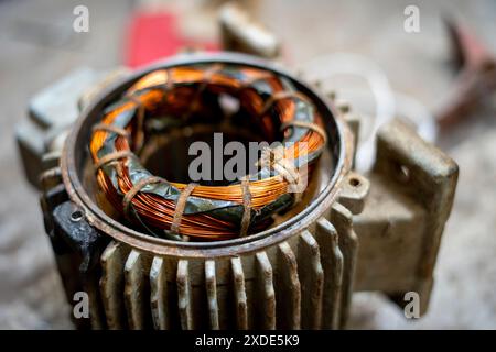 Inside of a disassembled machine containing a round copper coil Stock ...
