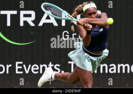 Coco Gauff, of the United States returns a backhand shot from Eva Lys ...