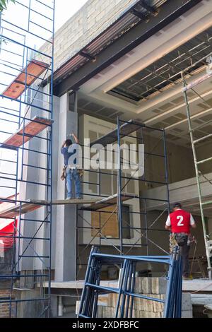 Mexican construction workers finishing interior house Stock Photo - Alamy