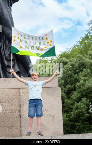 People during a Restore Nature Now rally at Parliament Square in ...