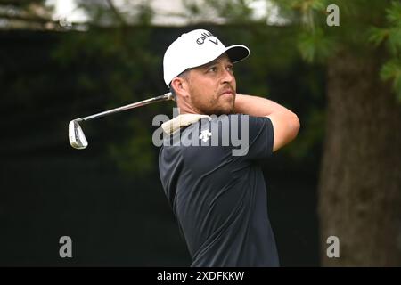 Xander Schauffele watches his tee shot on the 14th hole during a ...