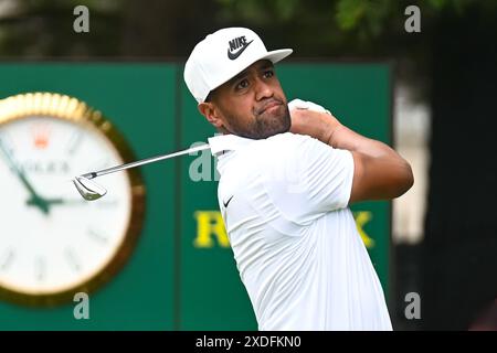 Tony Finau watches his tee shot on the night hole during the first ...