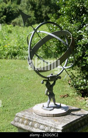 Garden with sun dial, ornamental decor, vintage barn, lavender Stock ...