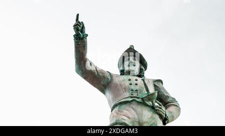 Columbus statue pointing at horizon on marble pedestal with map on ...