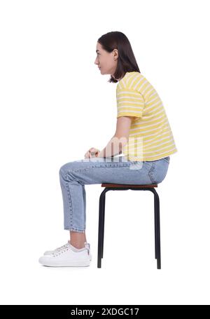 Woman with poor posture sitting on chair and using smartphone against ...