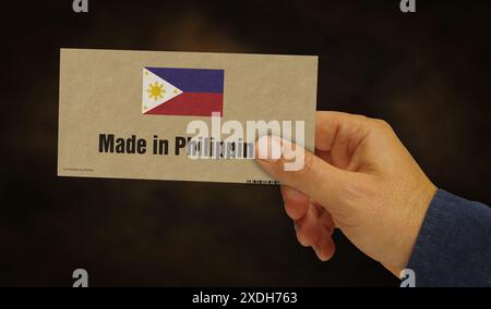 Made in Philippines Philippines box in hand. Filipino, flag ...