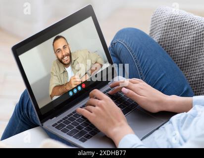 Woman chatting on video call on cellphone with earphone at outdoor ...