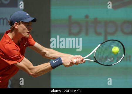 Jannik Sinner of Italy plays a backhand return to Alex de Minaur of ...