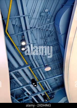 Ceiling with pipes and lights in creates industrial a pattern Stock ...