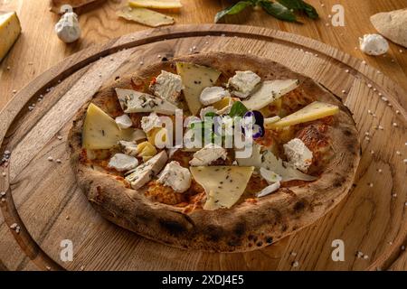 Four cheese pizza served basil Stock Photo - Alamy