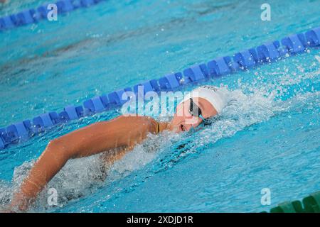 Competitors swim in the women's 800m freestyle timed heat during the ...
