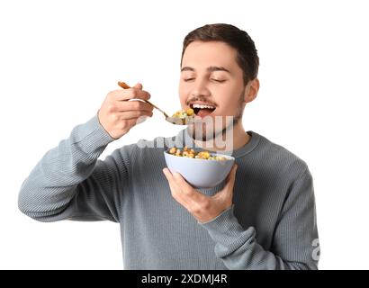 Man eating cereal rings on white background Stock Photo - Alamy