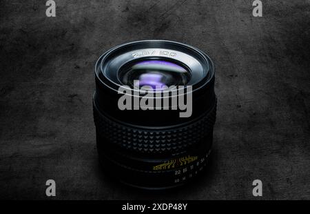 Camera lens on dark background Stock Photo - Alamy