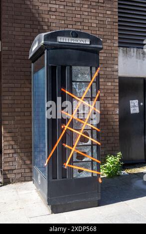 Vandalised telephone box in Liverpool city centre Stock Photo - Alamy