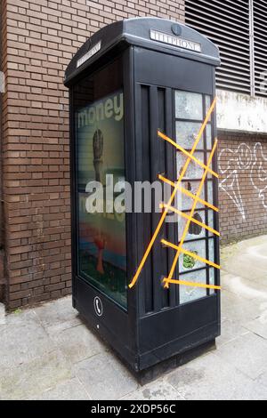 Vandalised telephone box in Liverpool city centre Stock Photo - Alamy