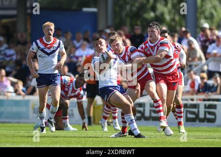 Wakefield Trinity's Oliver Pratt is tackled by Leigh Leopards' David ...