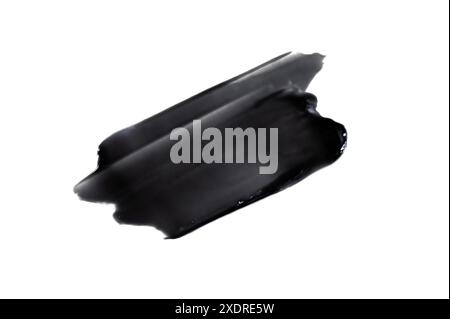 Black charcoal face mask smear isolated on white background. Abstract ...