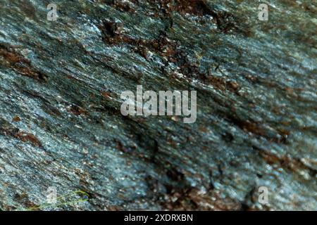 A sample of bright apple-green chlorite schist against a black ...