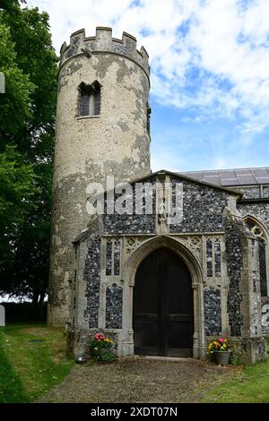The round towered St Michael's Church, Aslacton, Norfolk, England, UK ...