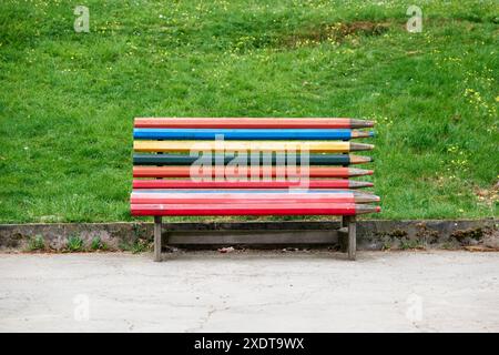 Creative colorful street park wooden bench painted in bright colors ...