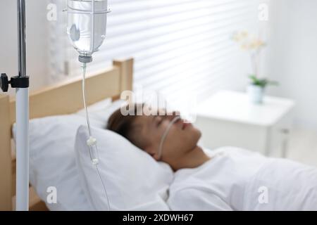 Coma patient. Young man sleeping in hospital bed, selective focus Stock ...