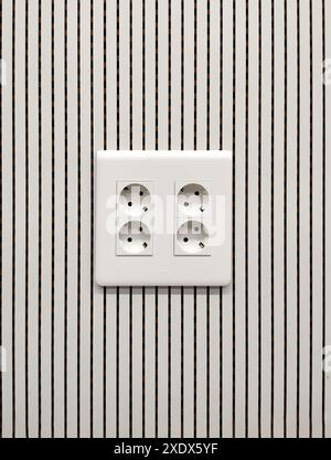 Quad socket on a wall with vertical lines paper Stock Photo - Alamy