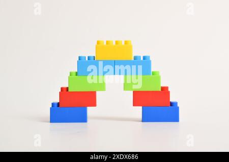 A rainbow color lego stairs isolated on white background. Building ...