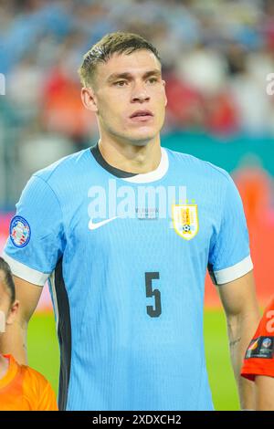 Uruguay midfielder Manuel Ugarte #5 passes the ball during the Group ...