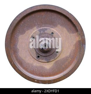 Rusty solid iron wheel from an retro tractor with yellow lichen spots ...